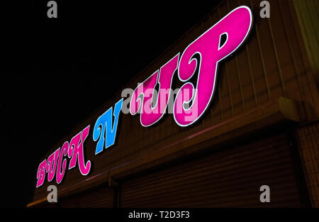 Buck N Up dollar-store, closed storefront and business sign during ...