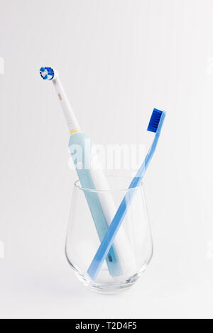 Manual Regular Toothbrush Against Modern Electric Toothbrush. Isolated ...