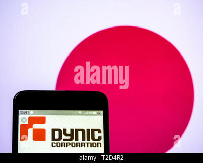 In this photo illustration a Dynic Corporation logo seen displayed on a ...