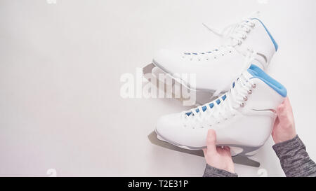 Flat lay. New figure skates on a white background Stock Photo - Alamy