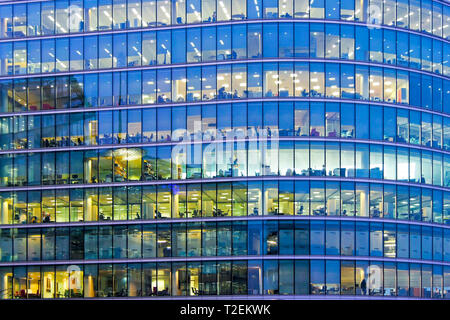 Side view of blue glass corporate building Stock Photo - Alamy