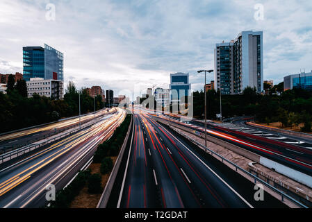 M30 motorway in Madrid at sunset. Long exposure with traffic light ...