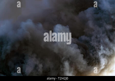 Thick black acrid smoke on the sky background Stock Photo - Alamy