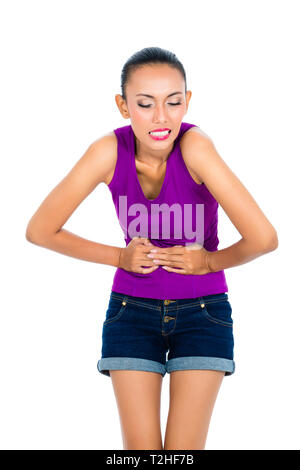 Painful woman touching stomach over white background Stock Photo - Alamy