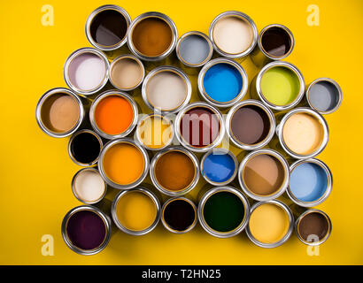Paint cans color palette, yellow background Stock Photo - Alamy