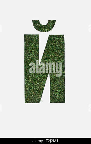 cut out cyrillic letter with fresh green grass on background and leaves ...