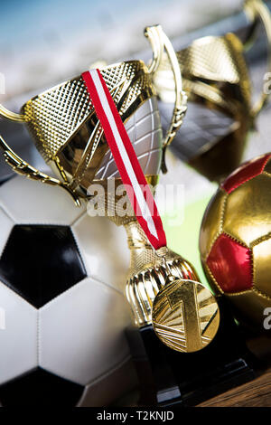 Winner trophy, Sport equipment and balls Stock Photo - Alamy