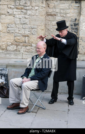 Bill Spectre wearing his traditional Victorian hat and cloak, giving ...