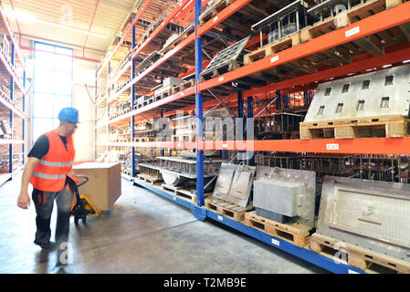 logistics and transport workers in a goods warehouse with goods for ...