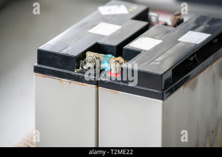 Old battery corrosion, seal lead acid battery damage Stock Photo - Alamy