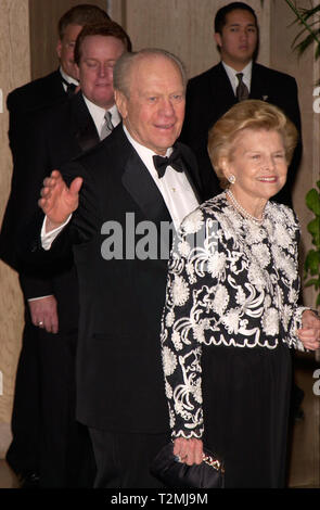 Former President Gerald Ford and his wife Betty stand under as arch ...