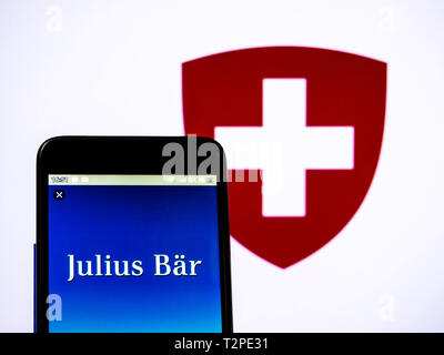 In this photo illustration a Julius Bar Group logo seen displayed on a ...