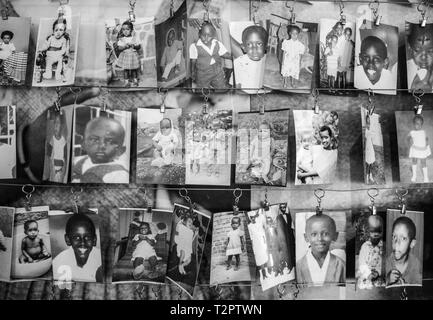 Photographs of known victims of the 1994 Rwandan Genocide line the ...