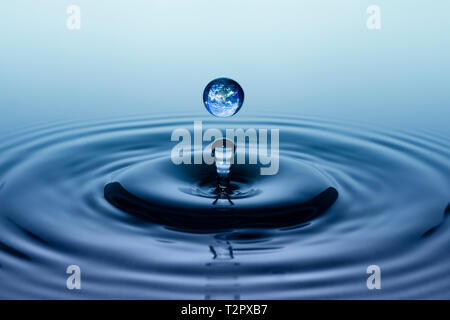 Drop of rain with earth image falling on smooth water surface Stock ...