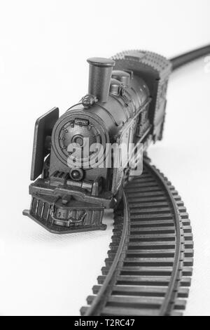 Black painted toy steam engine model. For off track, financial crash ...