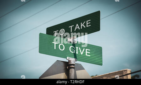 Street Sign to TO GIVE versus TO TAKE Stock Photo - Alamy