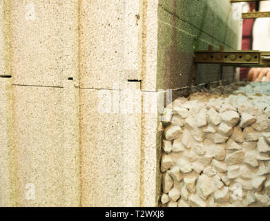 construction frame with insulating styrofoam and reinforced concrete ...