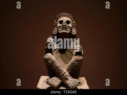 MEXICO CITY: Stone statue of Xochipilli, god of art, games, beauty ...