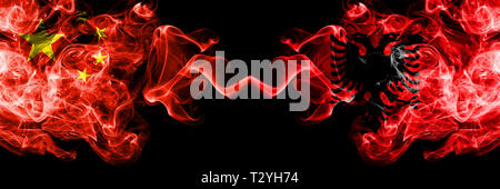 Flags of China, Chinese vs Albania, Tirana. Smoke flag placed side by ...