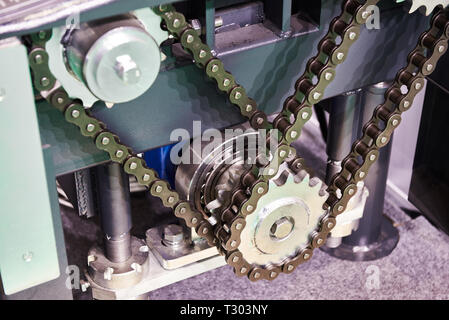Gear, chain drive shaft in conveyor, belt is on production line. Timing ...
