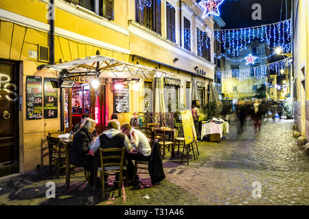Street with bars and restaurants in Trastevere at night. Rome, Province ...
