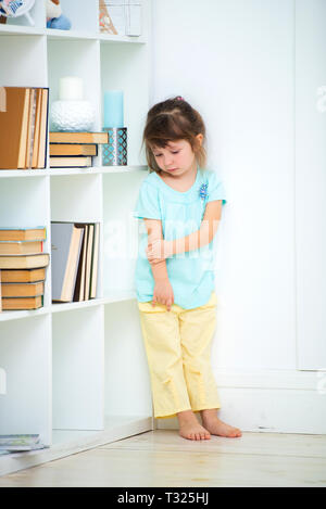 Child standing in the corner, facing the wall Stock Photo - Alamy