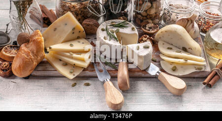 Assorted tasty cheese herbs and seasonings on wooden background Stock ...
