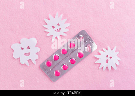 Close up of pink and blue Amoxicillin antibiotics capsule pills ...