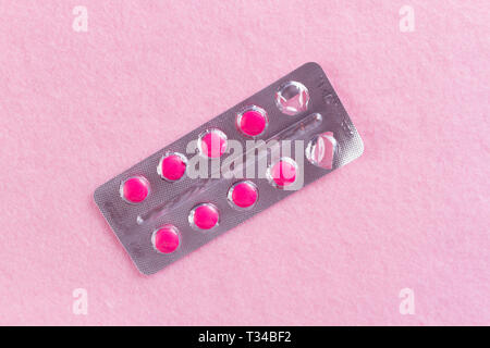 Close up of pink and blue Amoxicillin antibiotics capsule pills ...