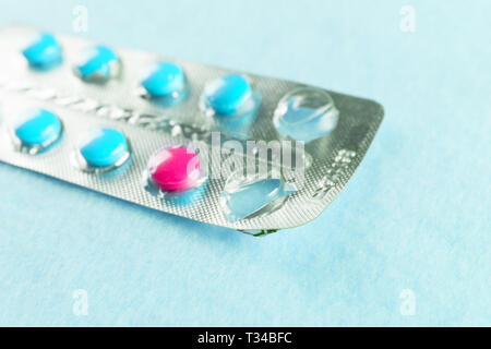 Close up of pink and blue Amoxicillin antibiotics capsule pills ...