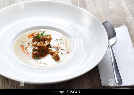 An exquisite, delicate cream soup served with crunchy crisps from baked ...