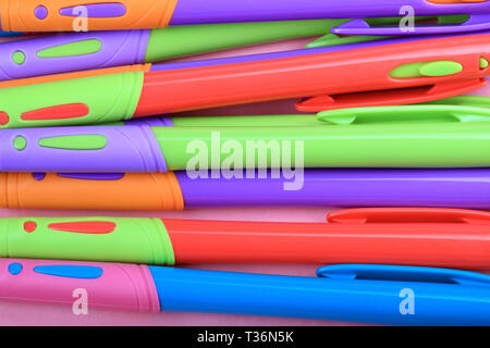 many Ball Pen on Pink Background Stock Photo - Alamy