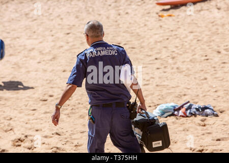 New South Wales ambulance at the beach with stretcher awaiting a ...