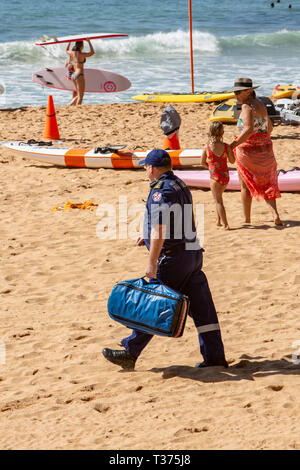 New South Wales ambulance at the beach with stretcher awaiting a ...