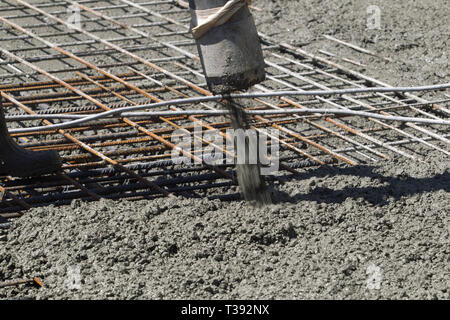 wooden and metal screed for concrete on the ground Stock Photo - Alamy