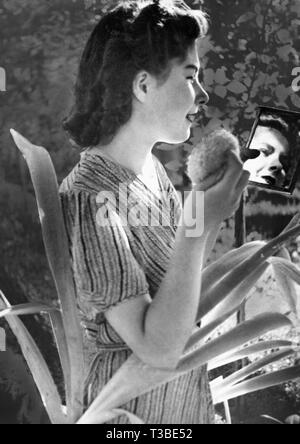 young woman making oneself up Stock Photo - Alamy