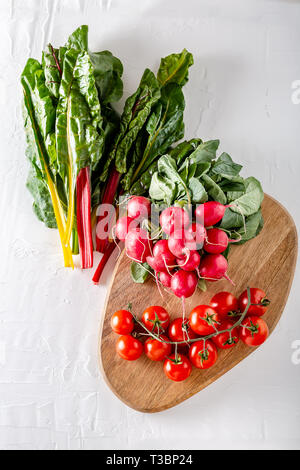 A single beautiful fresh rose in full bloom set against a wooden wall ...