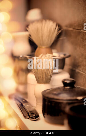 Hair trimmer and straight razor Stock Photo - Alamy
