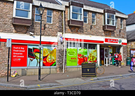 Spar small local corner shop convenience food store franchise - woman ...