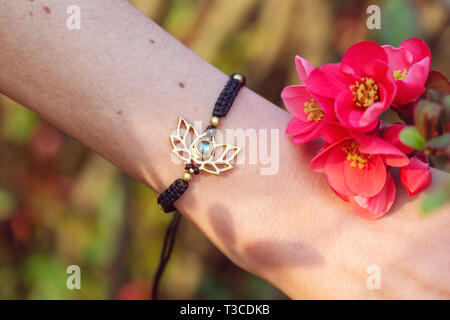 Lotus metal component labradorite stone bracelet on female wrist Stock ...