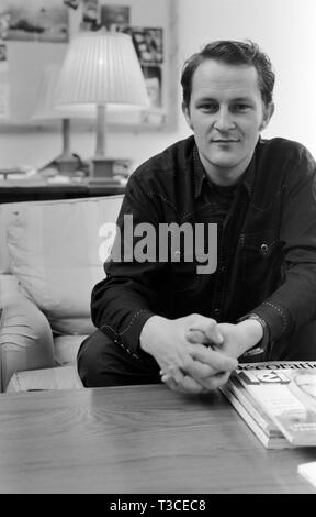 Nick Ashley Fashion Designer sitting in his office in London, UK Stock ...