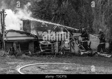 picture of trailer camper fire with burnt wood and debris Stock Photo ...