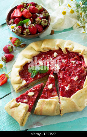 homemade strawberry Galette with fresh ripe strawberries on a dark ...