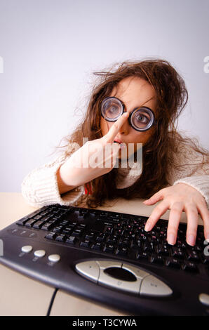 Funny nerd girl working on computer Stock Photo - Alamy