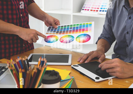 Graphic designers present colors from the color palette to their ...