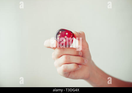 Hand throwing red dices, good luck concept Stock Photo - Alamy