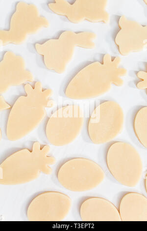 Flat lay. Unbaked Easter sugar cookies on a white table Stock Photo - Alamy