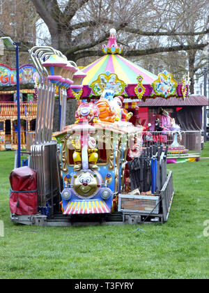 Toy train face fun fair ride Stock Photo - Alamy