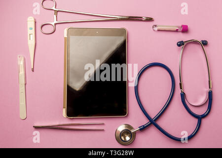 Tablet pc and doctor tools Stock Photo - Alamy