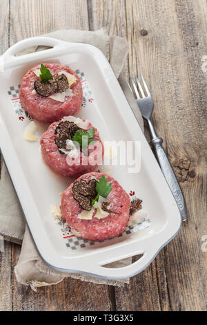 Beef tartare with fresh cheese, pickled onion, olives and fresh basil ...